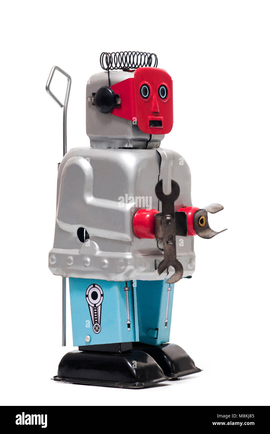 Vintage retro red face tin toy robot isolated on a white background ...