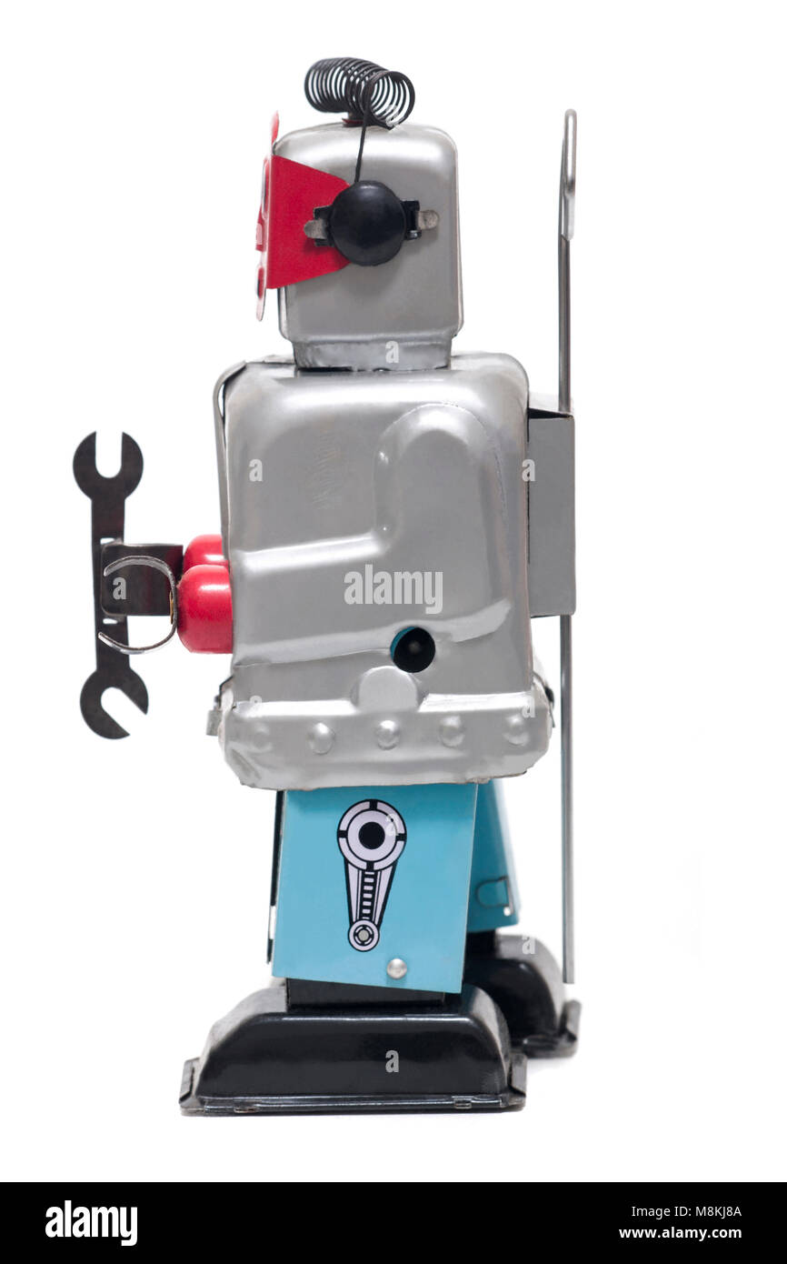 Vintage retro red face tin toy robot isolated on a white background ...