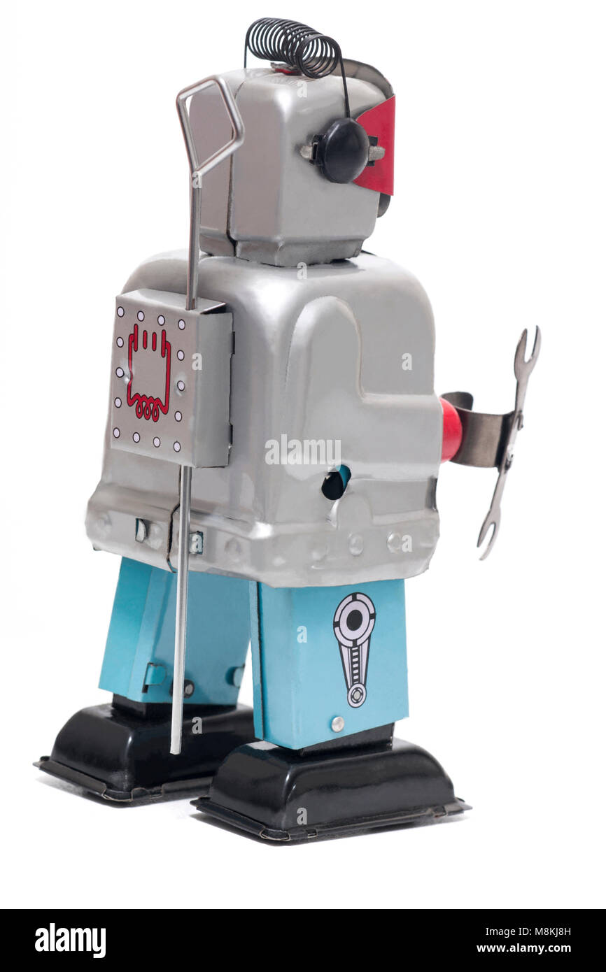 Vintage retro red face tin toy robot isolated on a white background ...