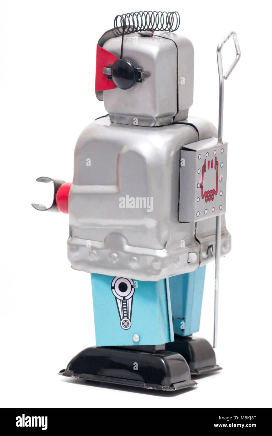 Vintage retro red face tin toy robot isolated on a white background ...