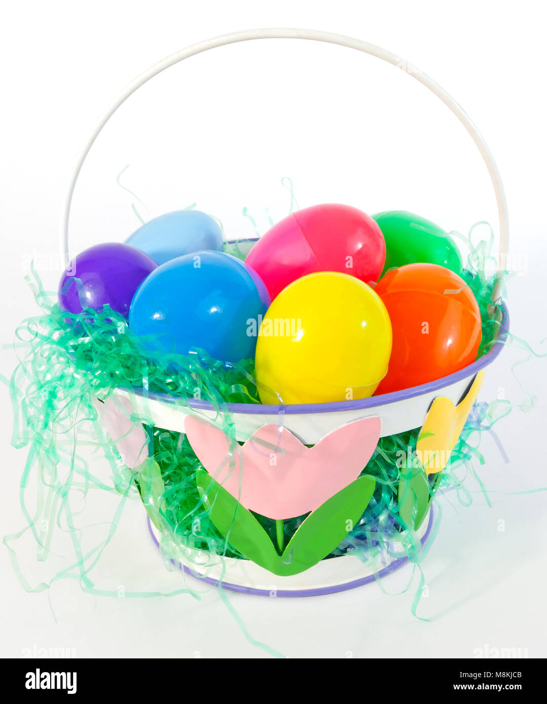 Easter basket filled with colorful plastic eggs Stock Photo - Alamy