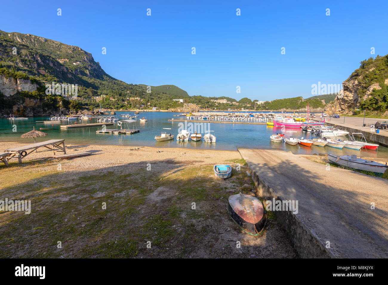 Alipa beach in Paleokastritsa bay with sand and crystal sea water ...