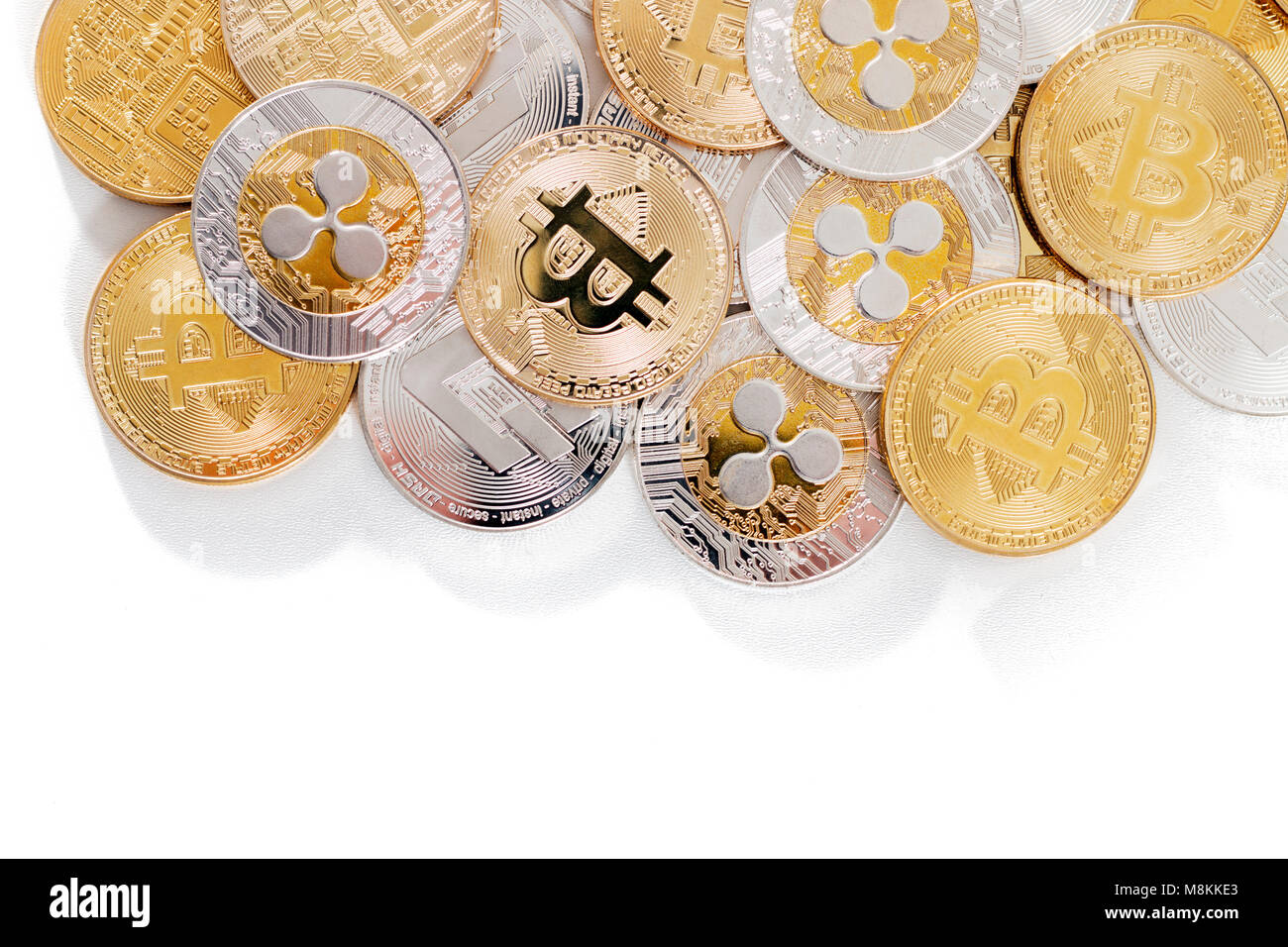 several aligned crypto currency coins on a white background Stock Photo ...