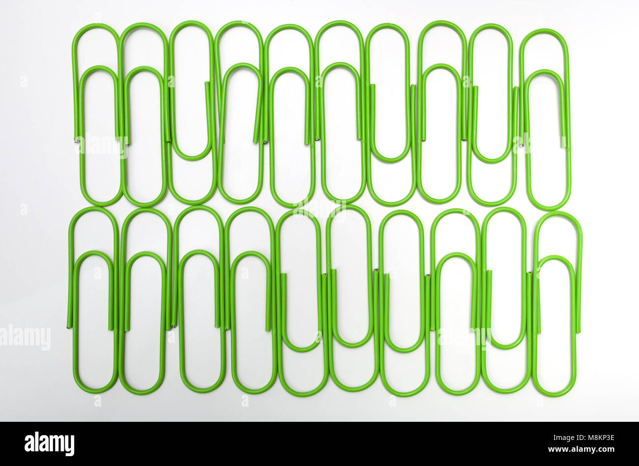 Green paper clips Stock Photo - Alamy