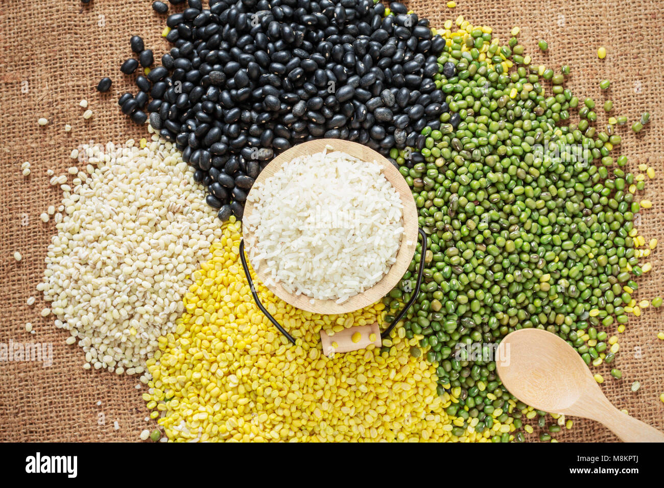Rice and many beans on sacks Stock Photo - Alamy