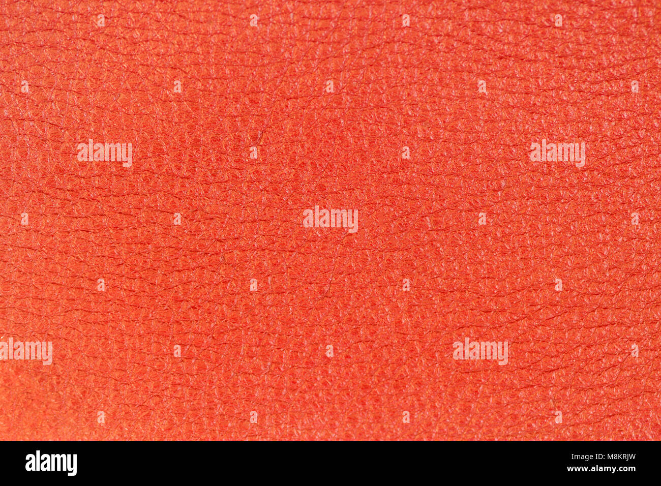Genuine leather texture, red color. Shopping, manufacturing concept ...