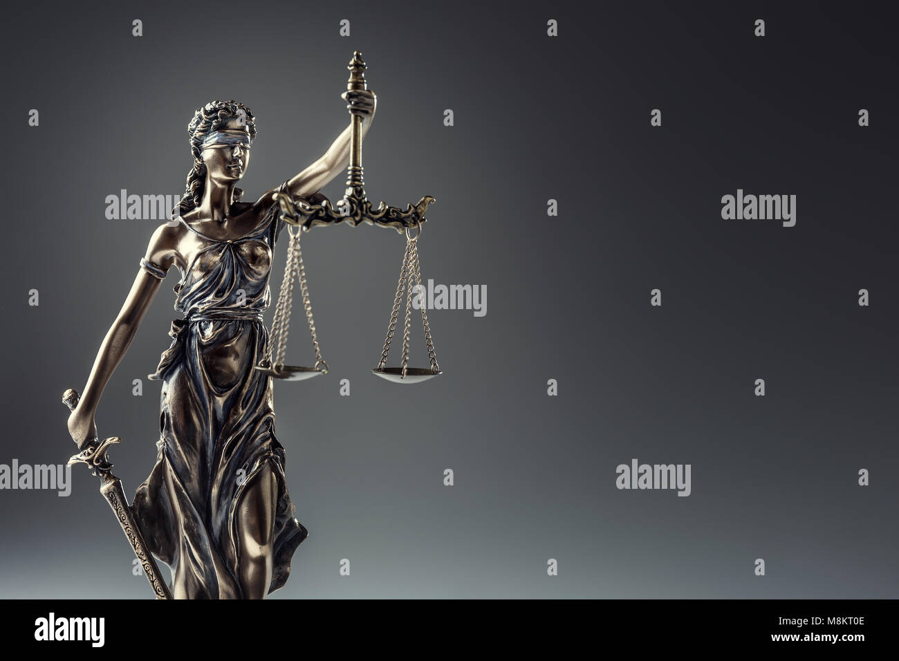 Statute of Justice. Bronze statue Lady Justice holding scales and sword ...