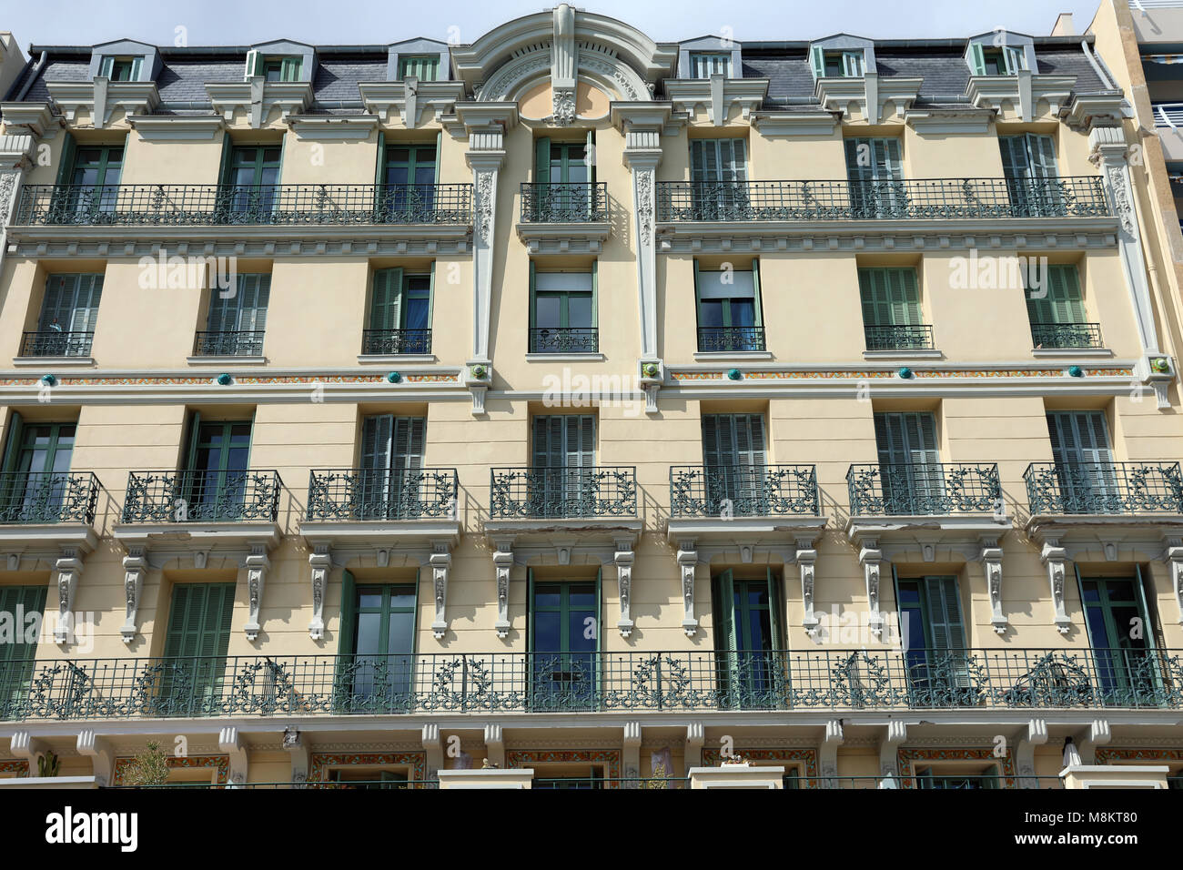 Facade of Traditional Building of French Riviera With Many Windows And ...