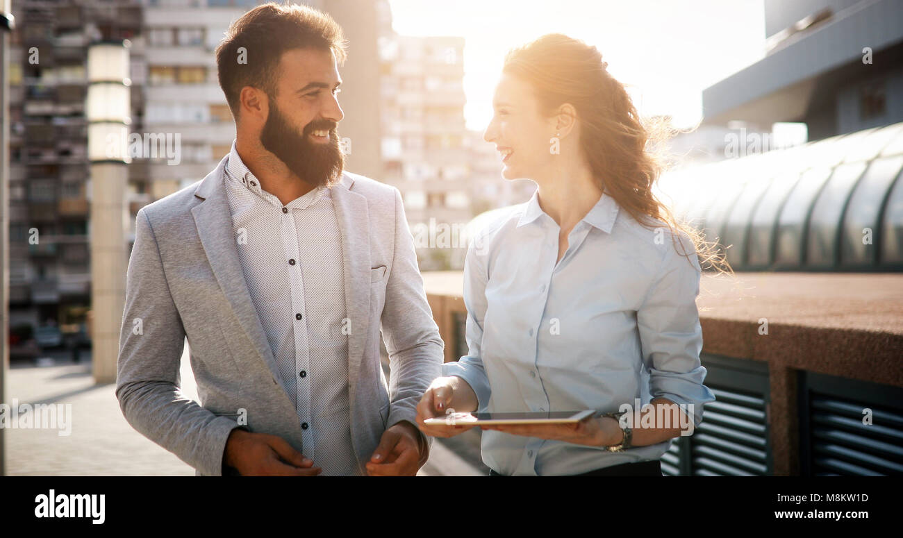Business colleagues talking on break from work Stock Photo - Alamy