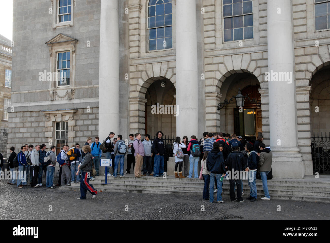 New students were waiting in a long queue to register at the University ...