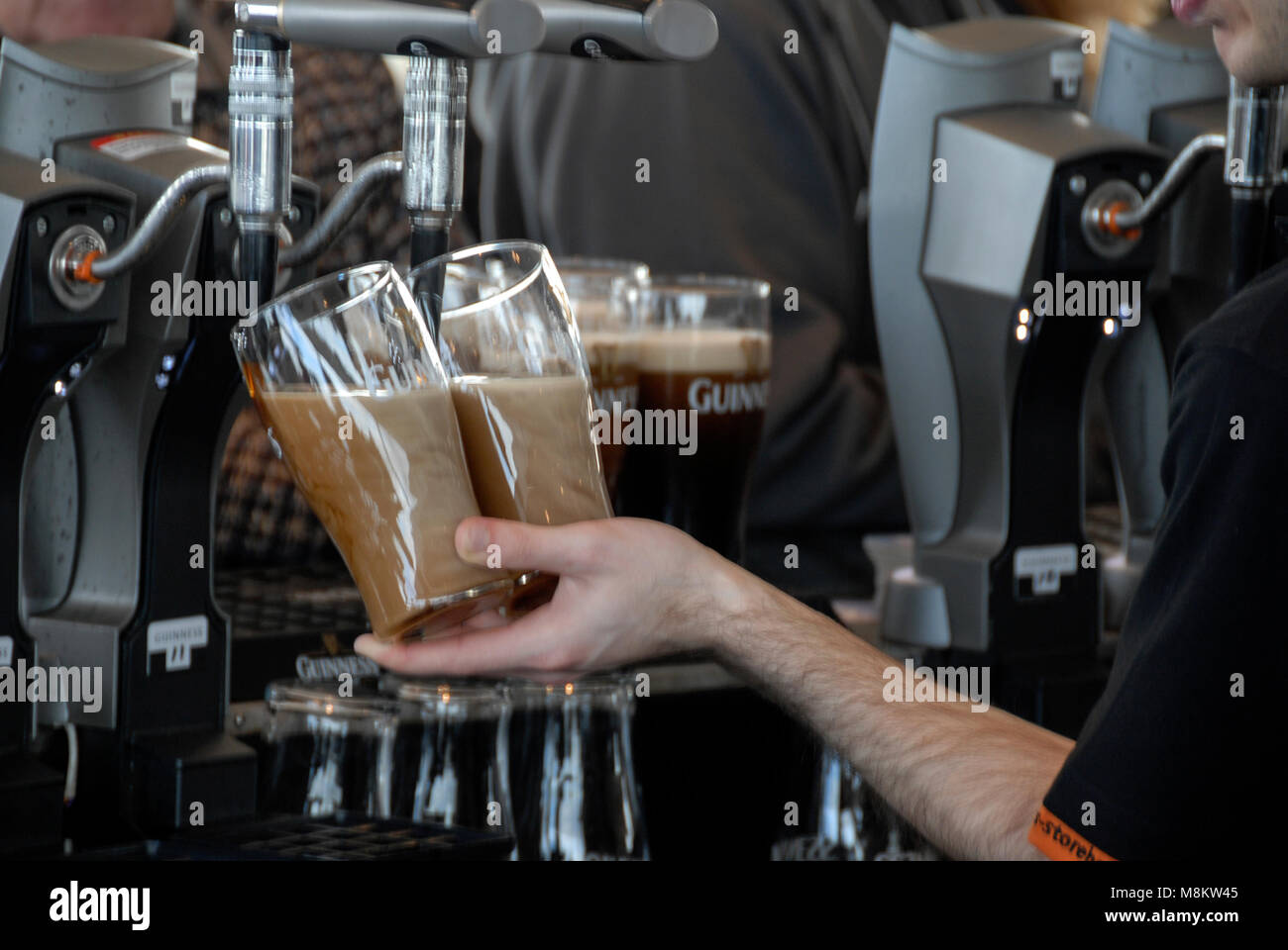 Guinness is poured into a pint glass at the Gravity bar where visitors ...