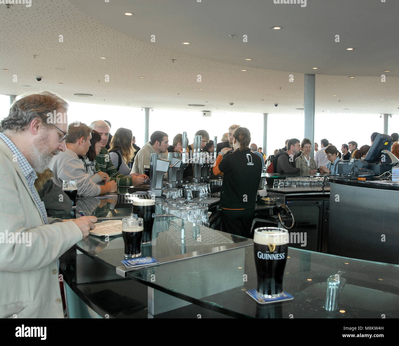 Visitors on a self-guided tour taste the dark stuff in the tasting lab ...