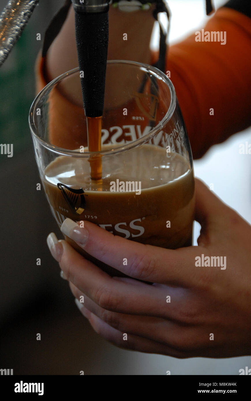 A pint of Guinness being poured into a pint glass at the Gravity bar ...