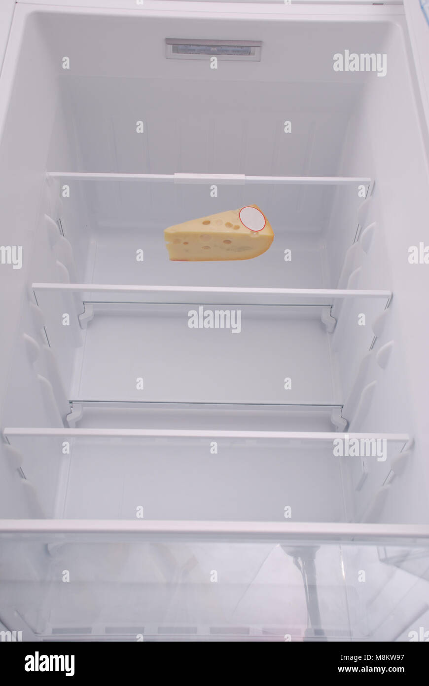 One cheese in open empty refrigerator. Weight loss diet concept Stock ...