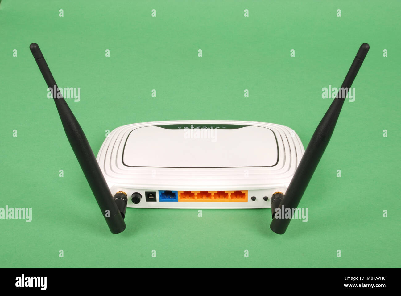 White WI-FI router with two antennas isolated on green background Stock ...