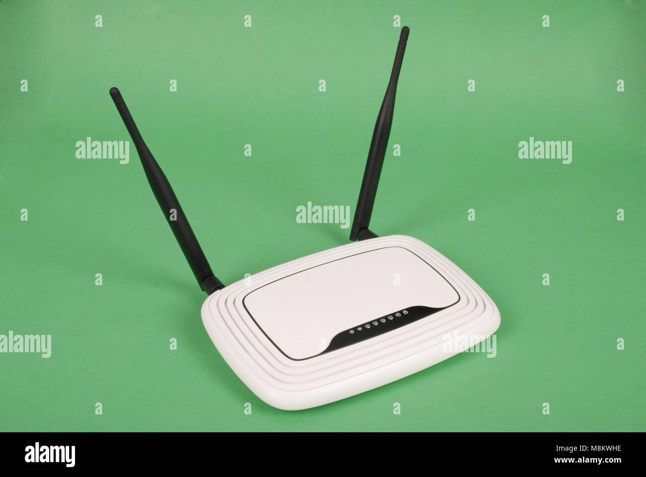 White WI-FI router with two antennas isolated on green background Stock ...