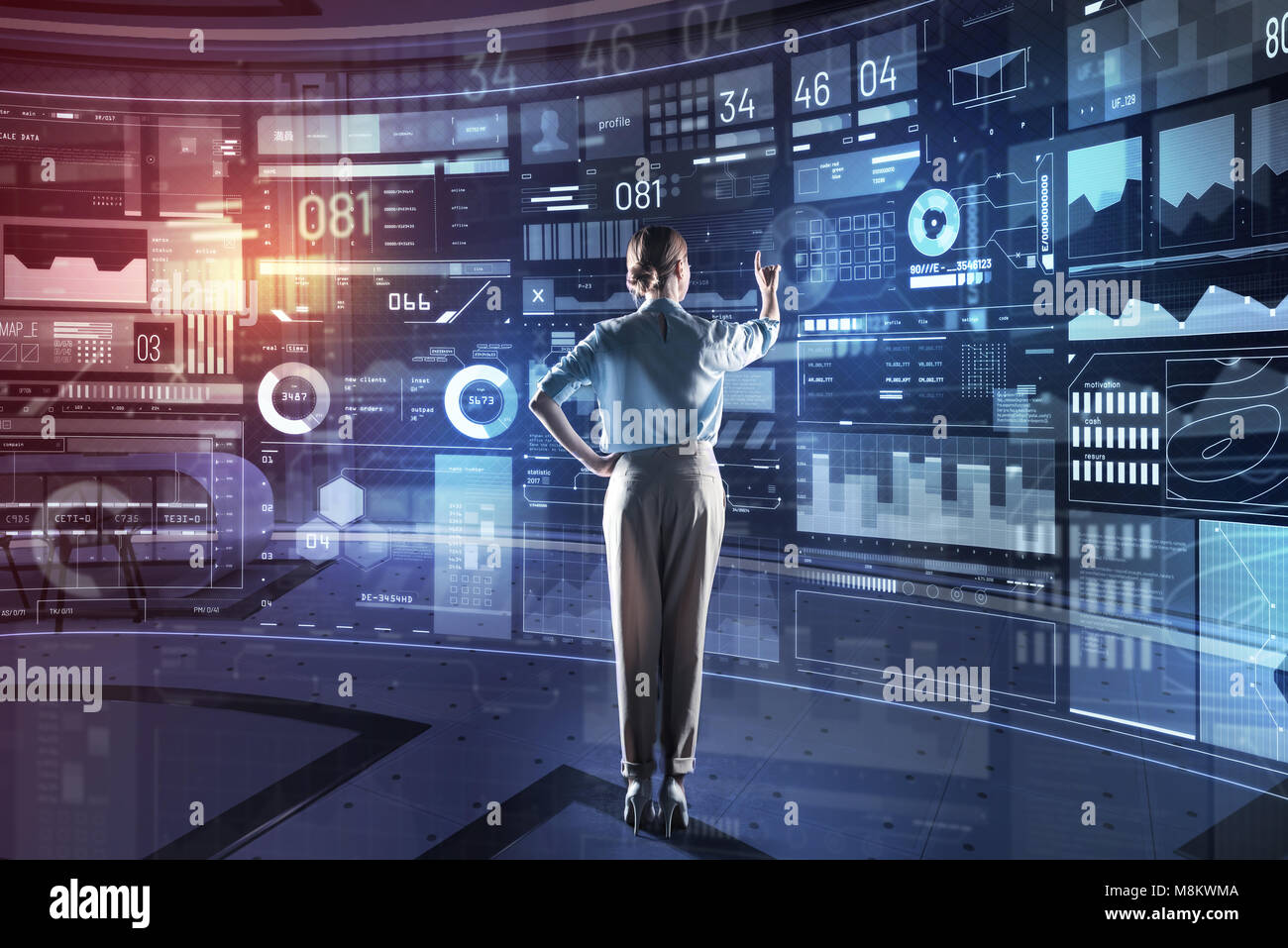 Attentive programmer touching the transparent screen while being at ...