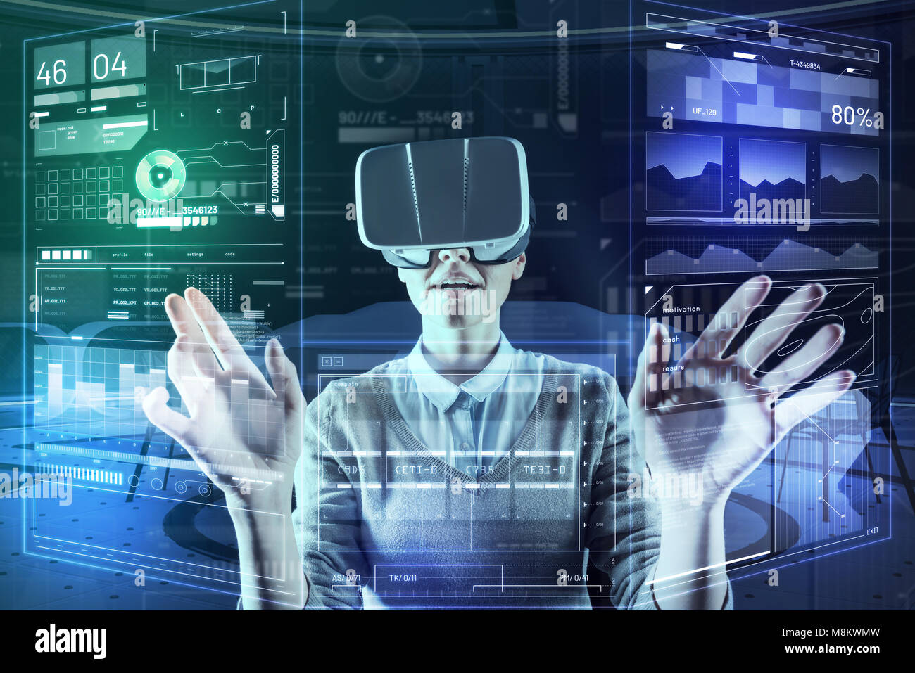 Young programmer looking impressed while wearing virtual reality glasses Stock Photo - Alamy