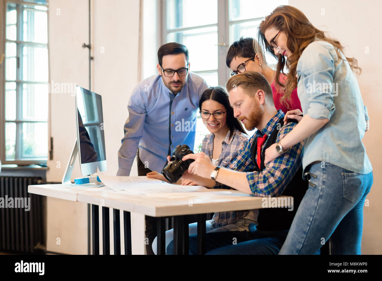 Professional creative team working on hi-res stock photography and ...