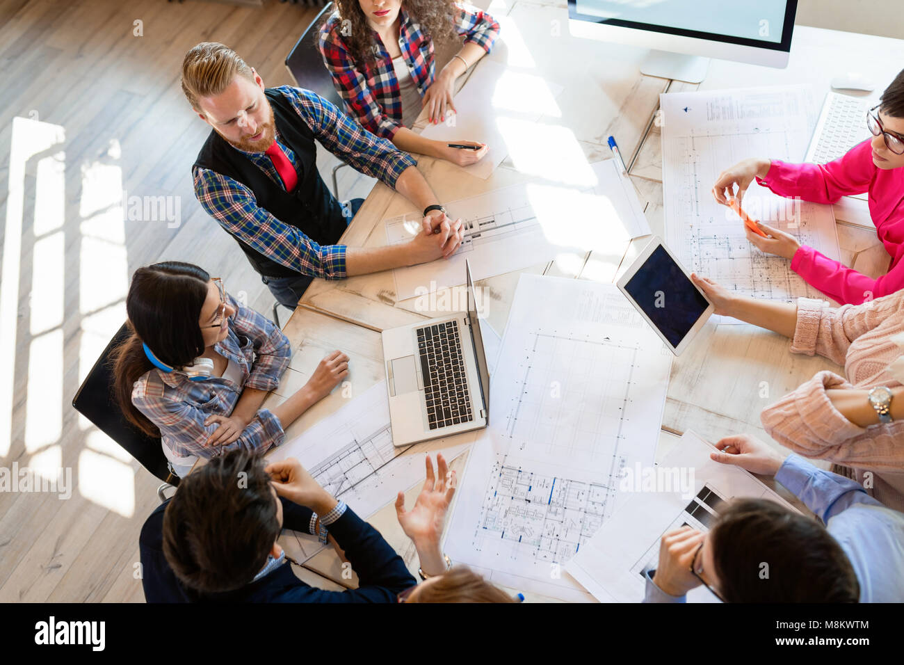 Group of architects working on project Stock Photo - Alamy