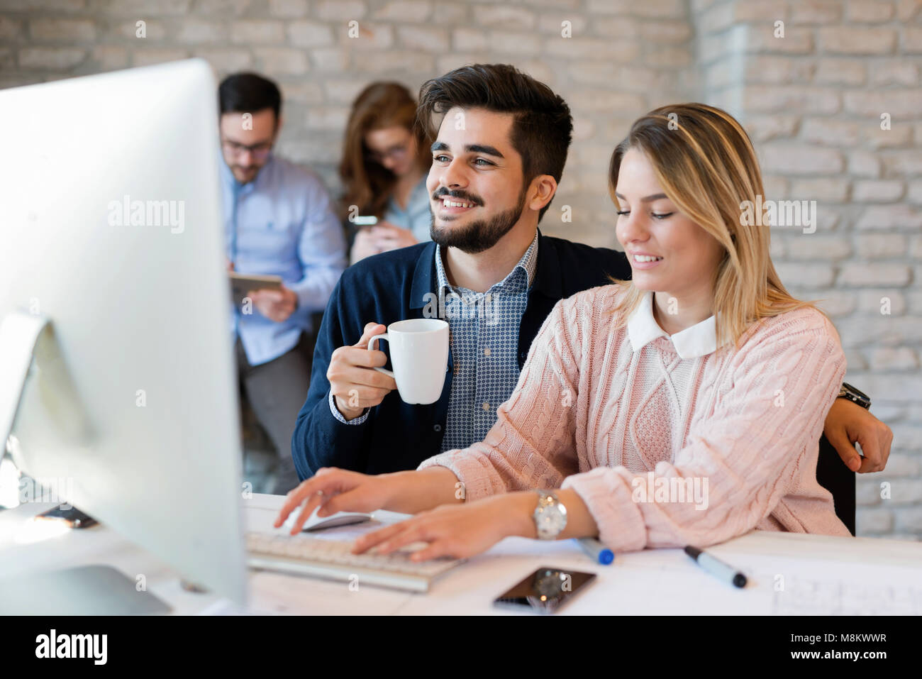 Company employees working in office Stock Photo - Alamy