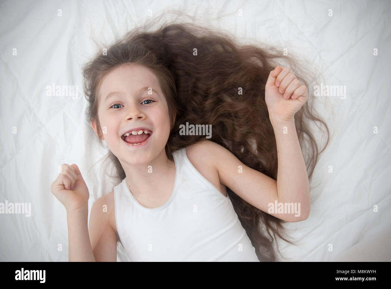 Cute Smiling Little Girl Woke up in White Bed. Morning in Wekeend. Flat ...
