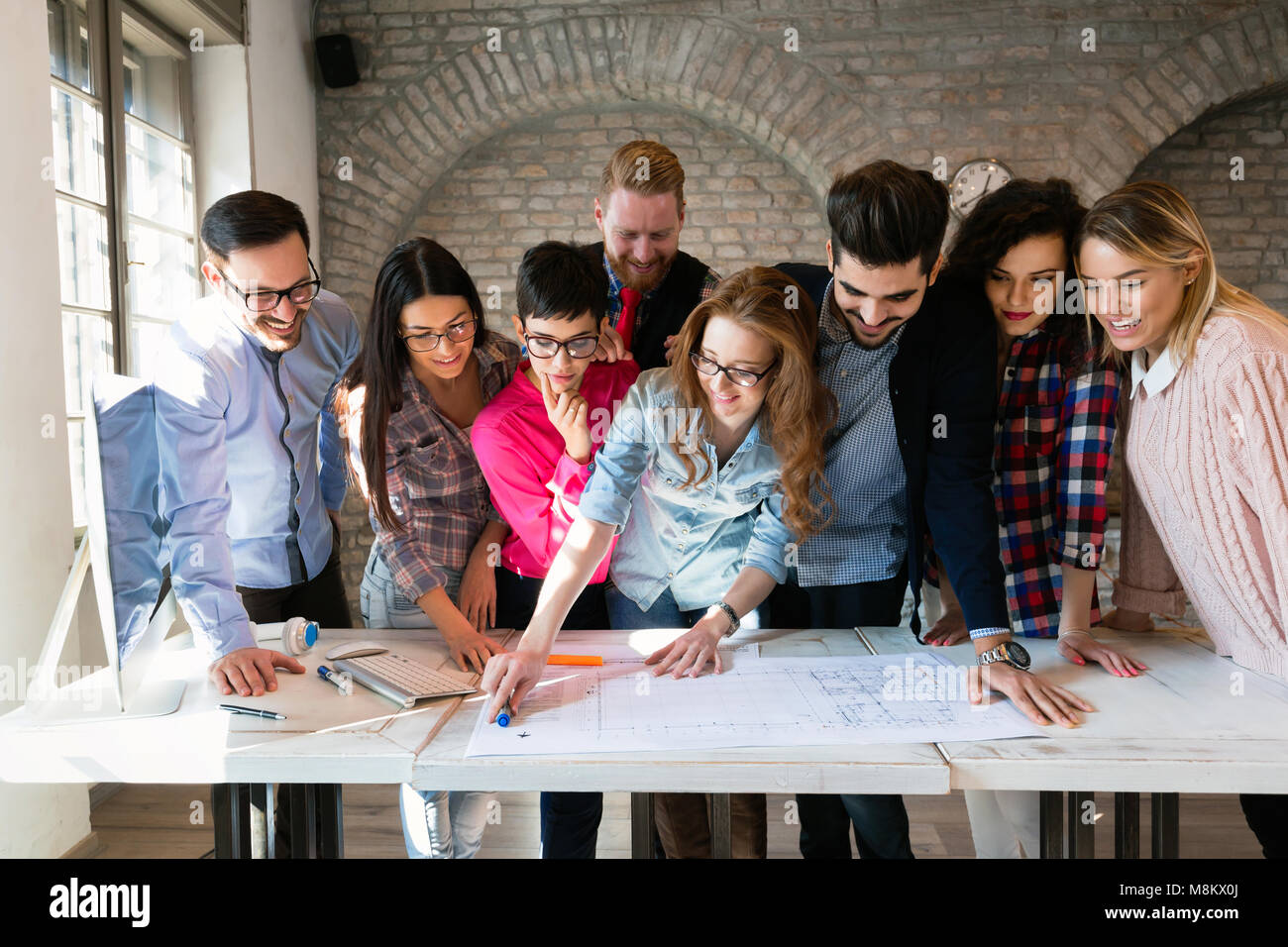 Group of architects working on project Stock Photo - Alamy