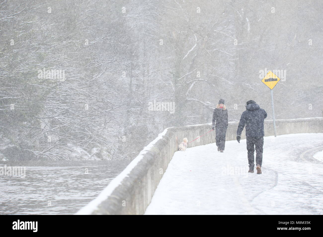 Dublin, Ireland. 18th march, 2018. People walk through snow and wind in ...