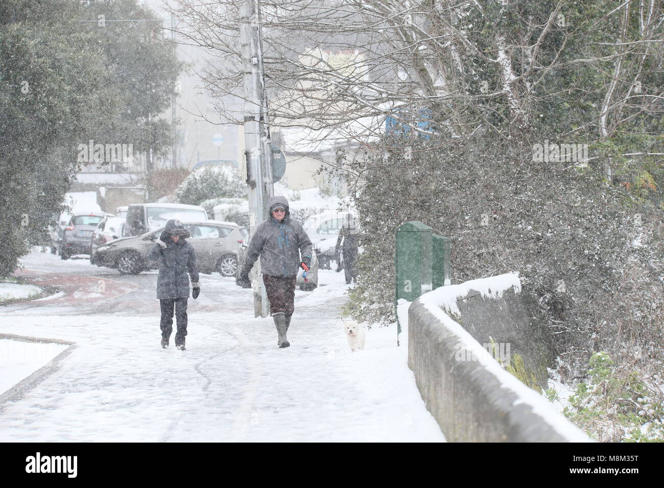 Dublin, Ireland. 18th march, 2018. People walk through snow and wind in ...