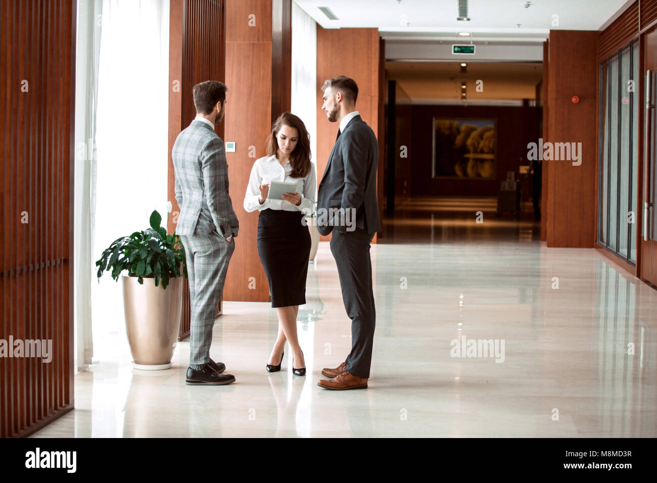 Interior Of Busy Office Foyer Area With Businesspeople Stock Photo - Alamy