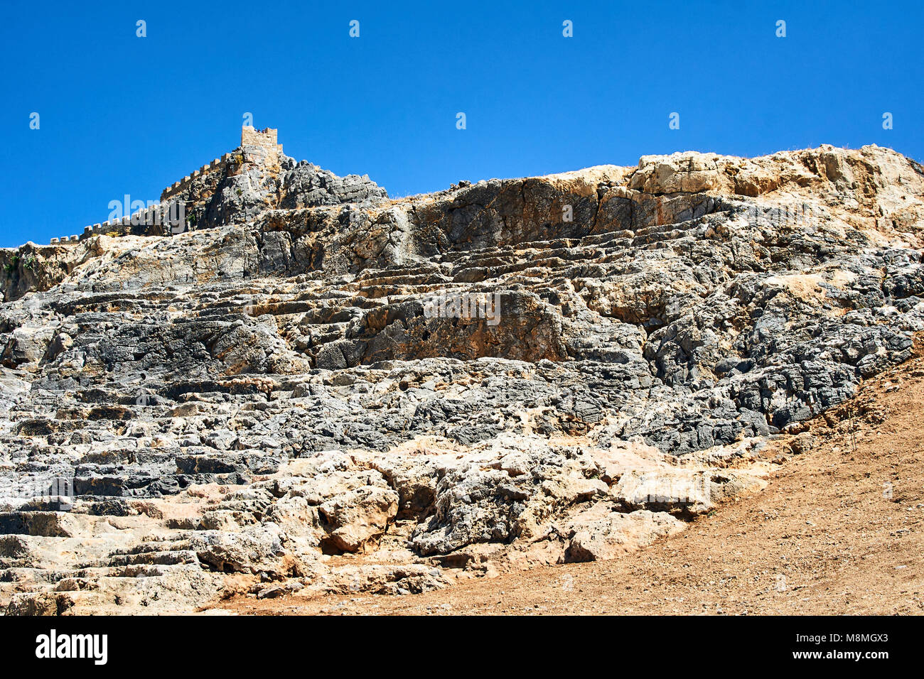 Antique amphitheater and medieval fortifications in Lindos Stock Photo ...