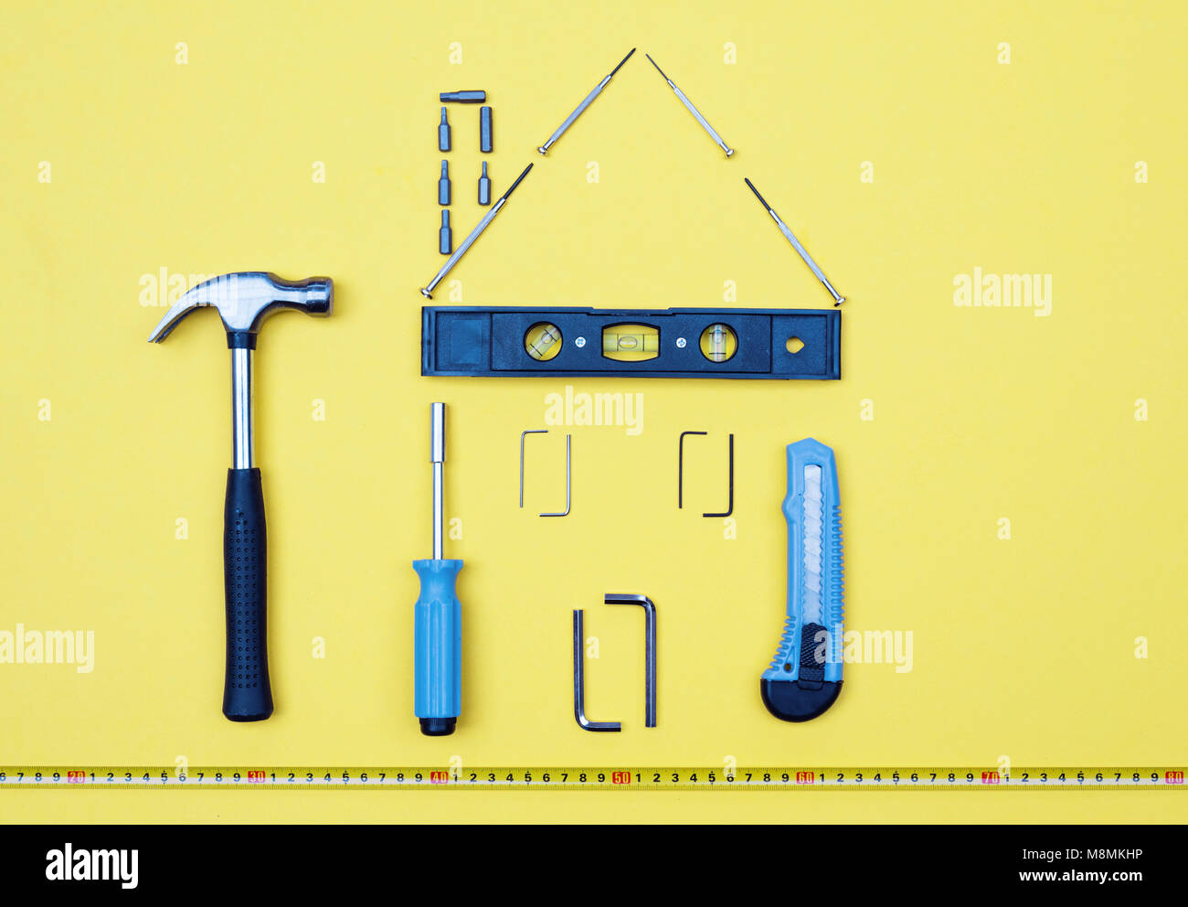 Selection of tools in the shape of a house home improvement concept on ...