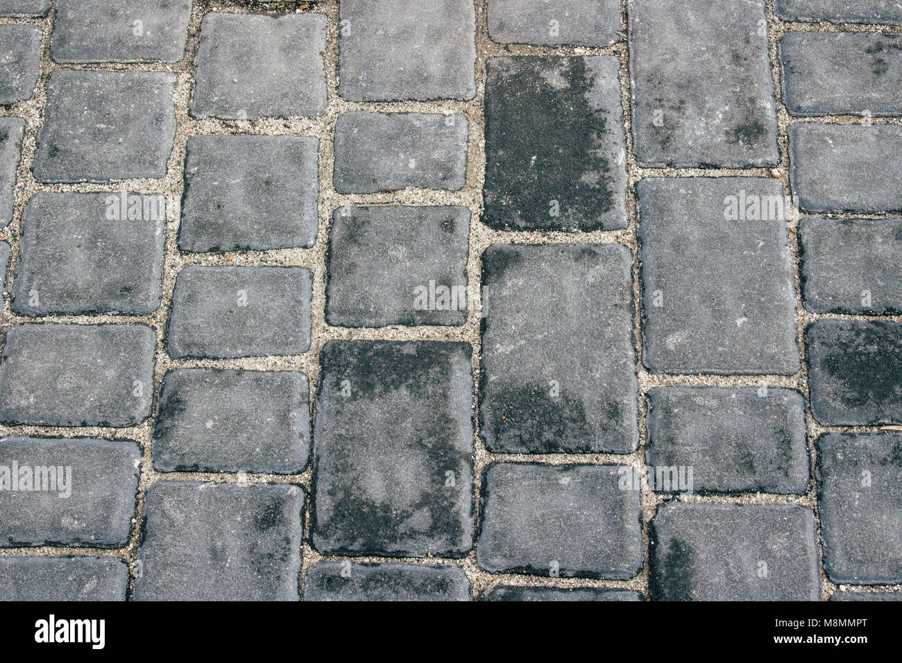 Background. Gray brick road after rain. Pattern Stock Photo - Alamy