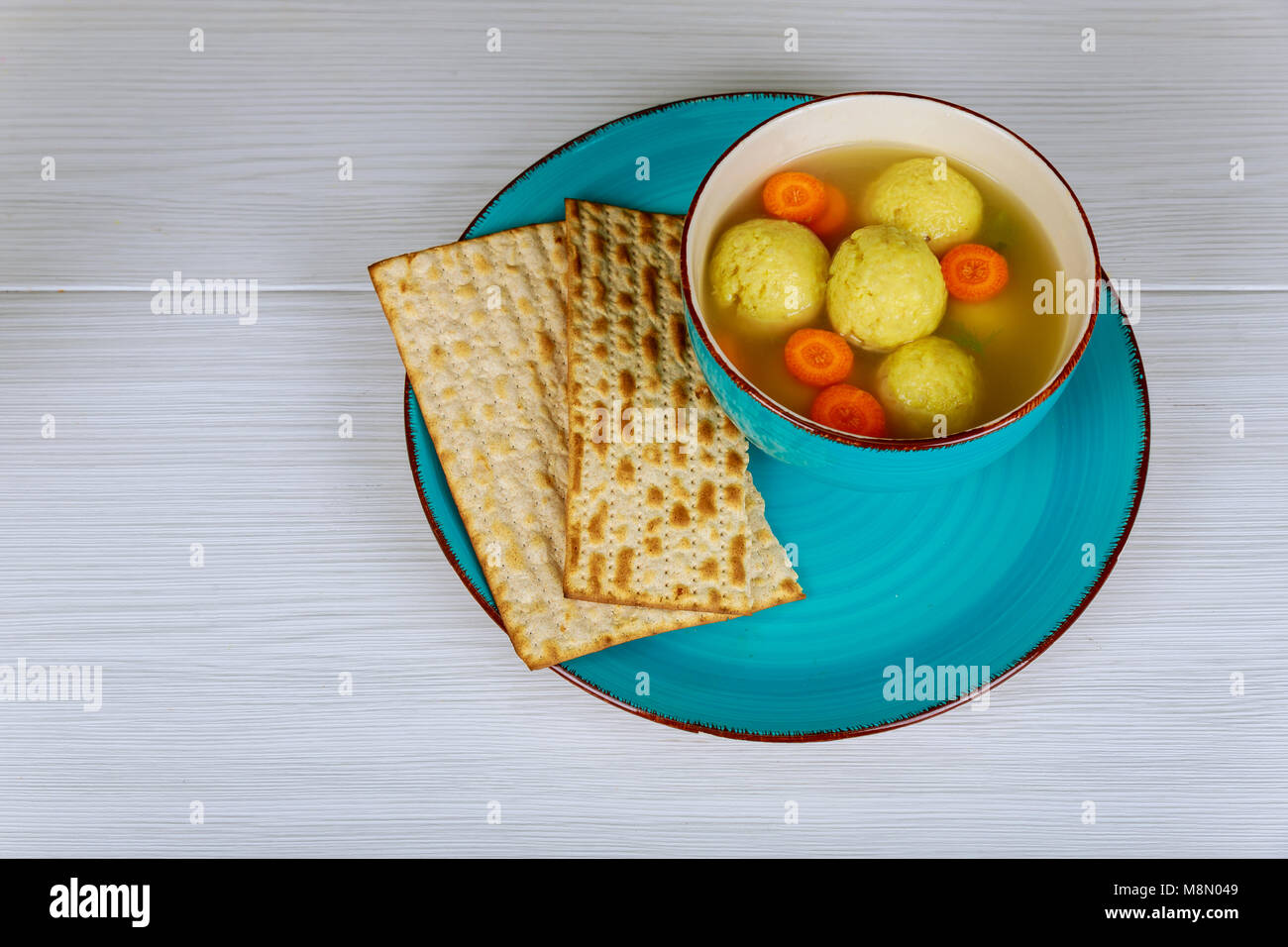 Traditional Jewish Matzah balls in a pot of soup during the Jewish ...