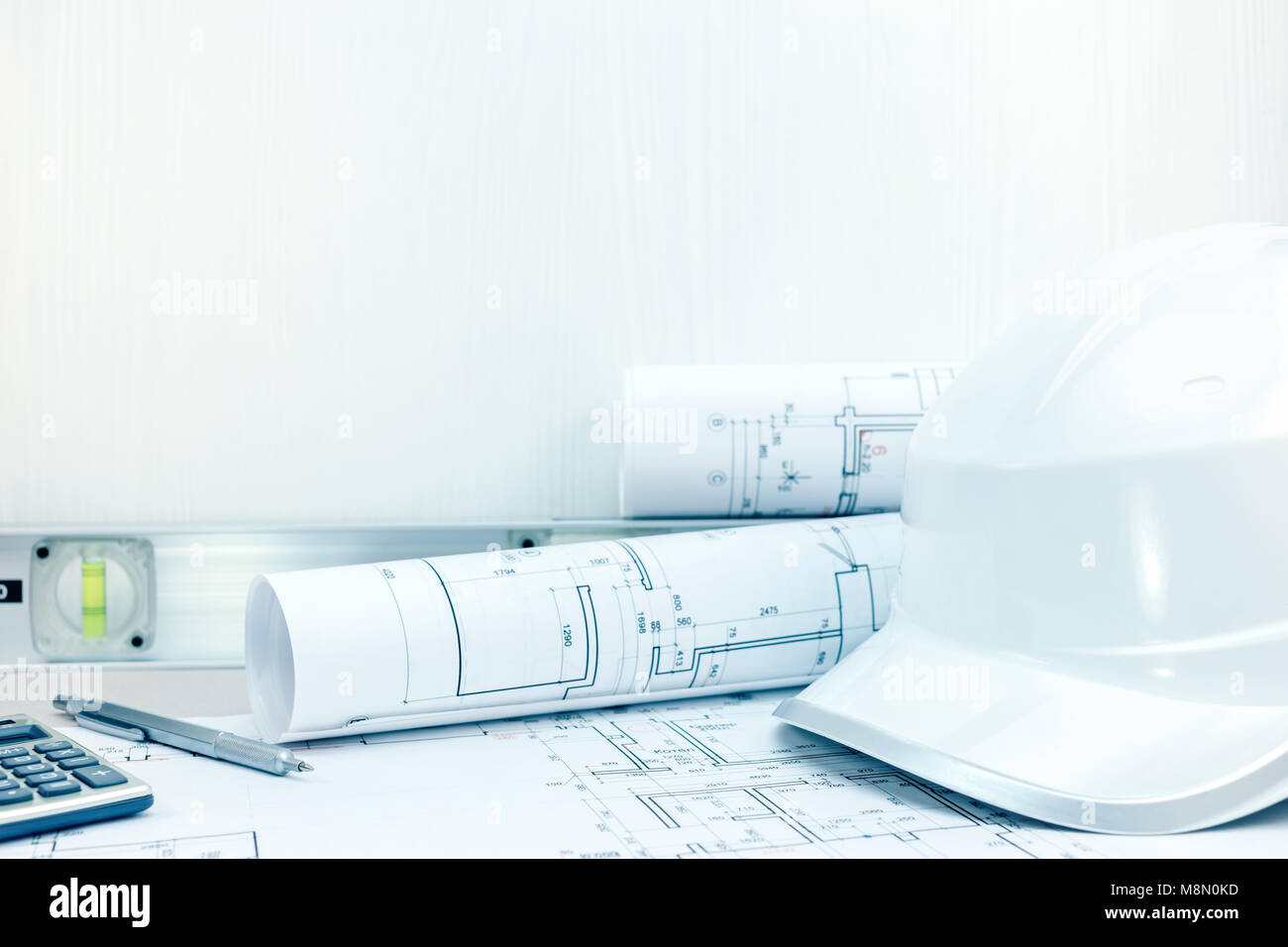 architect workplace. drawings of engineering projects, tools, safety ...
