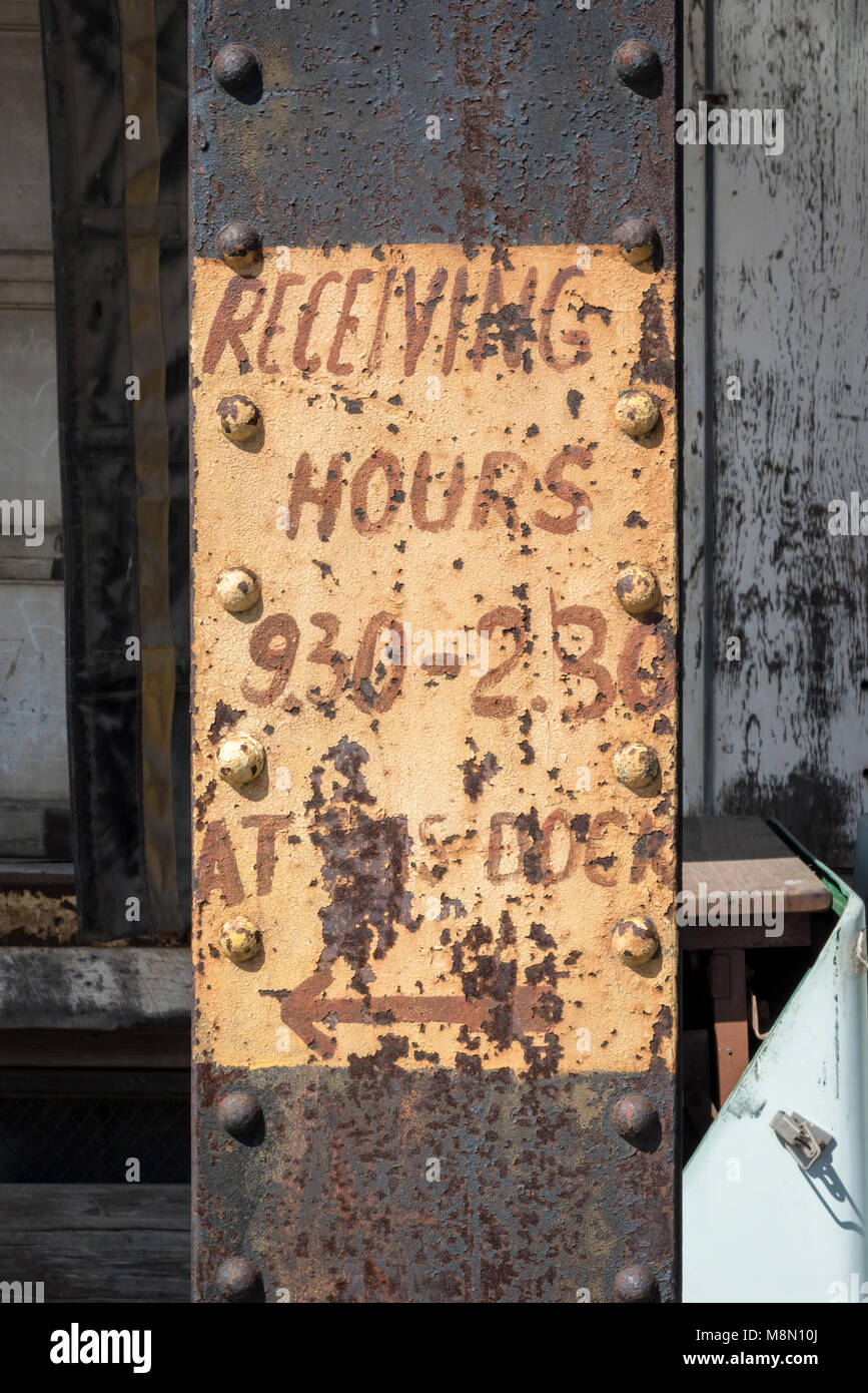 old hand painted sign on rusted steel beam at abandoned factory in ...
