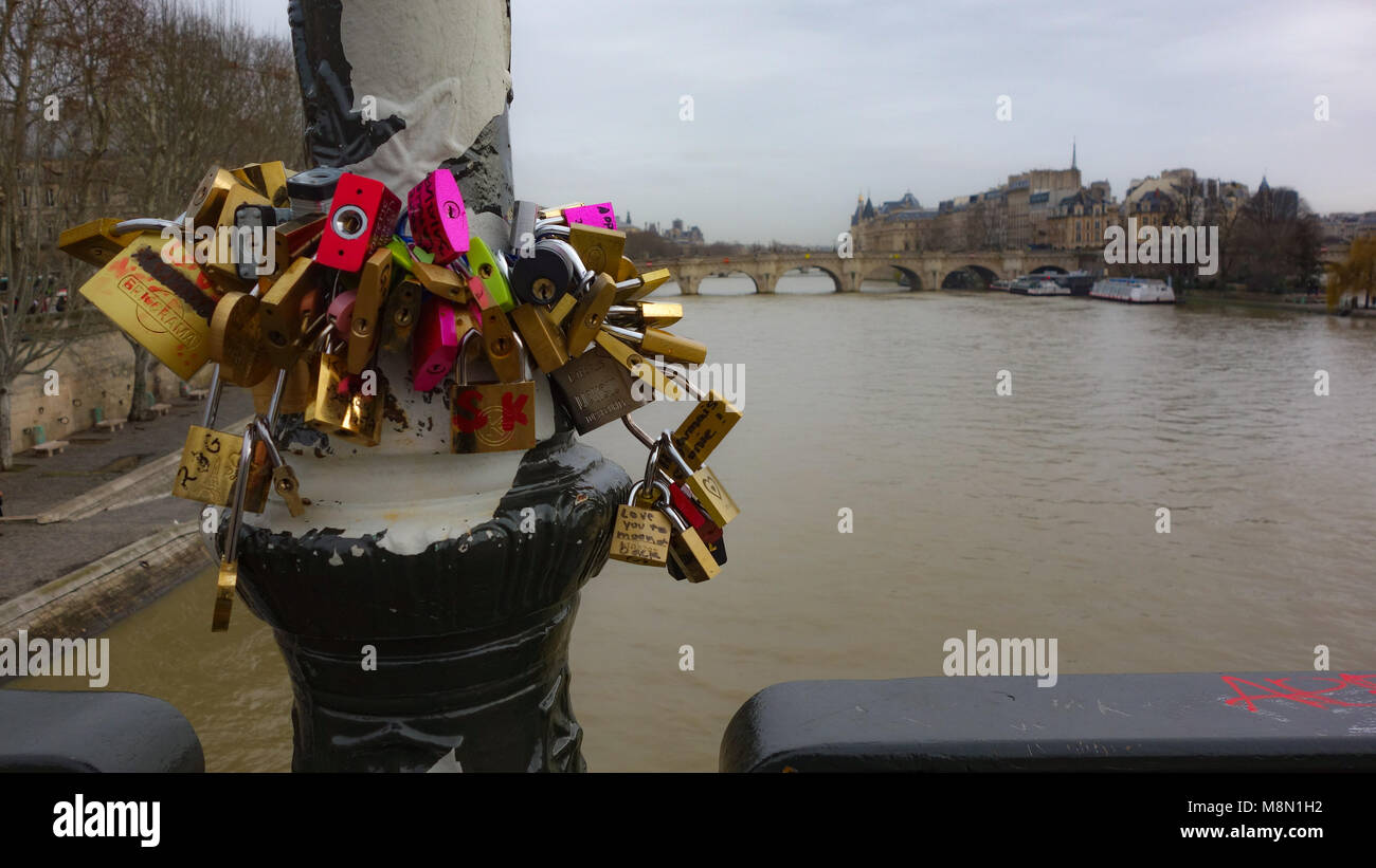 Love locks on the Pont des Arts bridge in Paris, above the river Seine ...