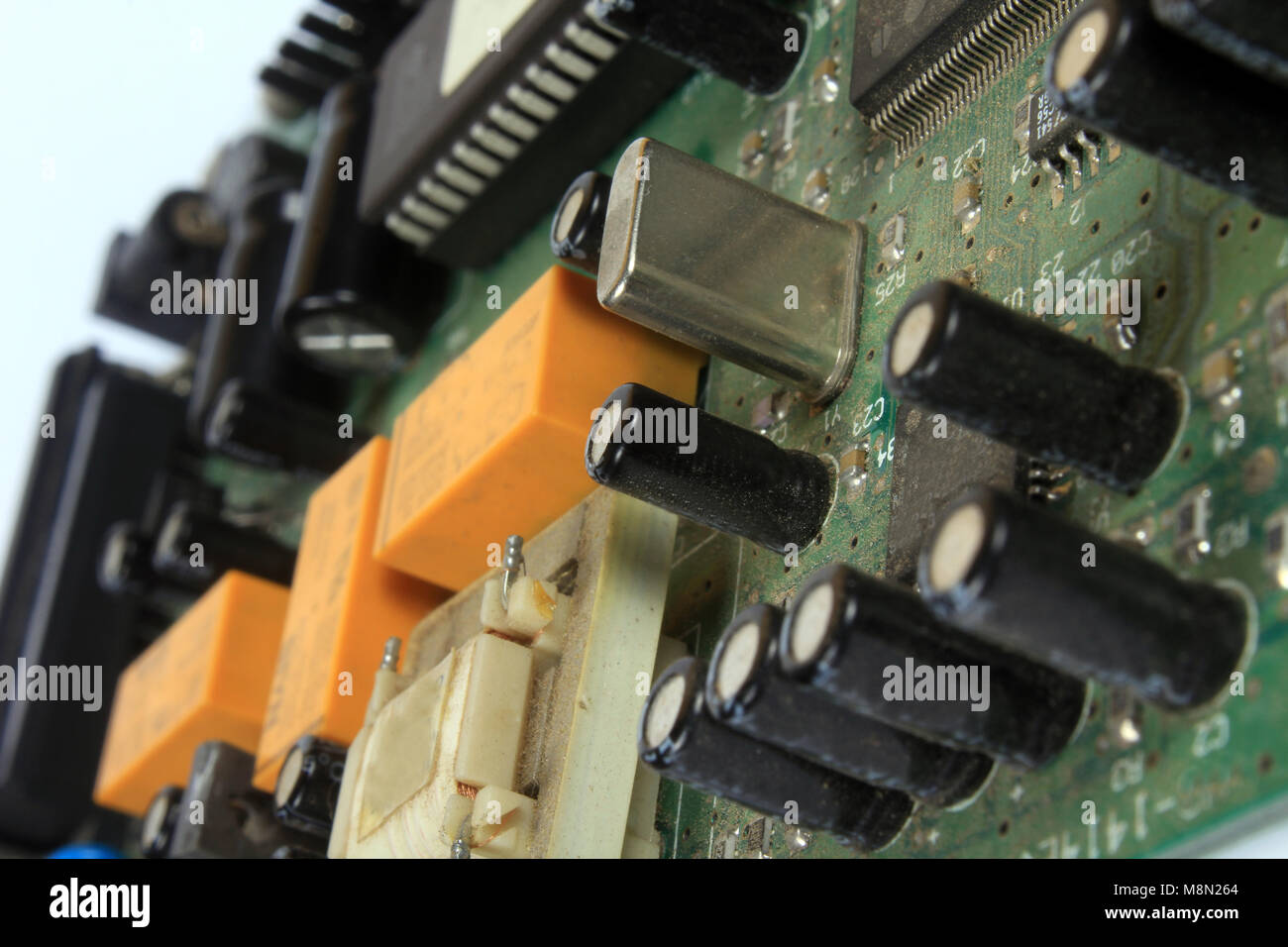 A closeup view of a very old circuit board inside an old internet modem ...