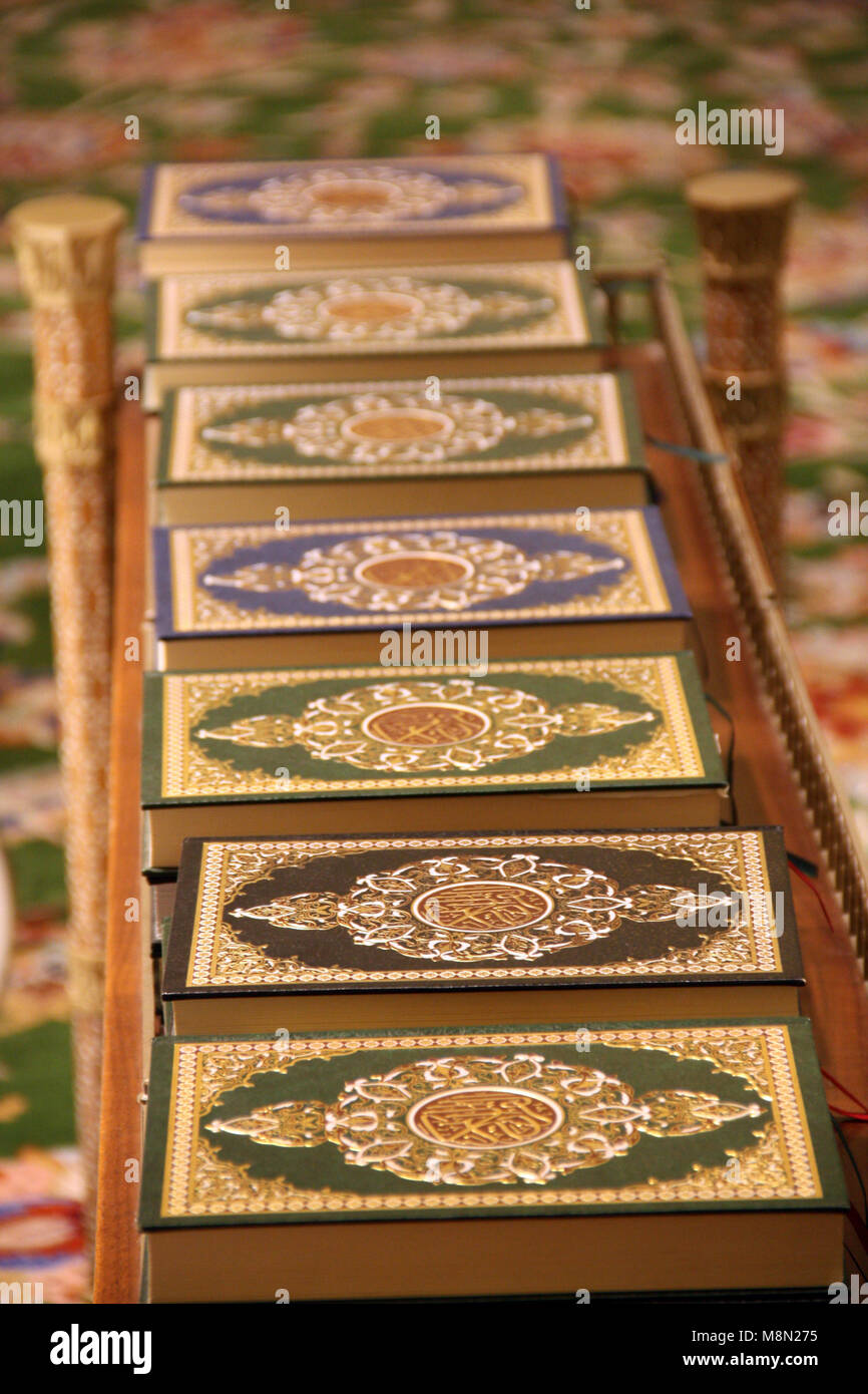 A line of holy Qurans in different cover designs at the grand mosque ...