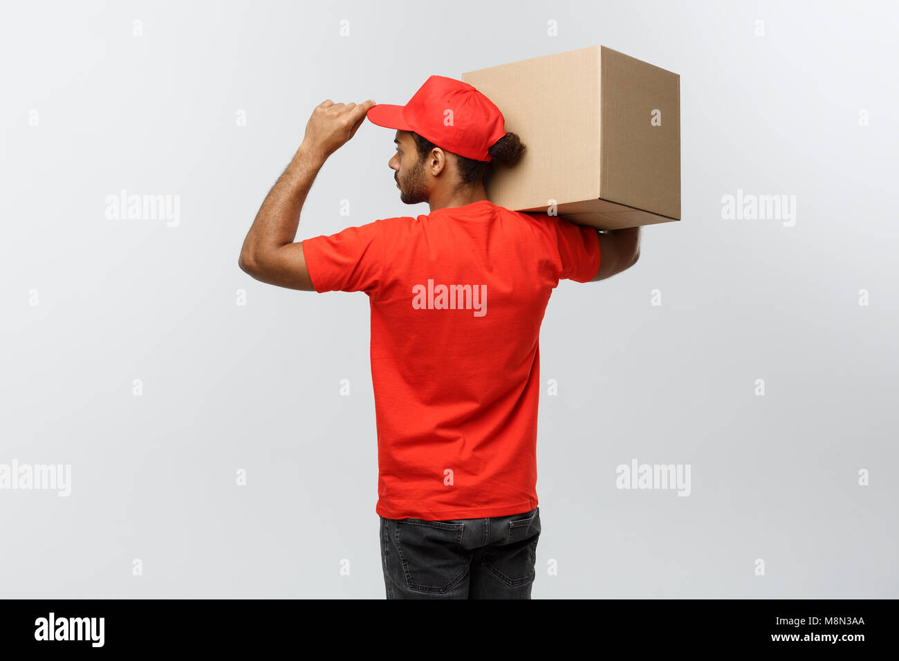 Delivery Concept - back view of Handsome African American delivery man ...