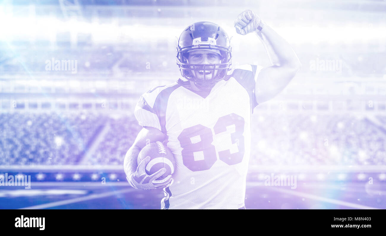american football player celebrating touchdown on big modern stadium ...