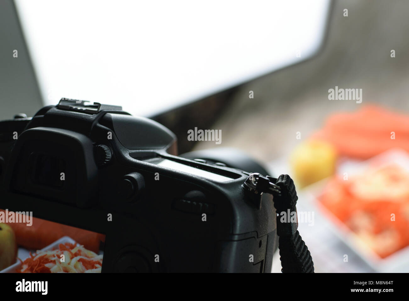Concept image - rear view of DSLR camera making a food photography in ...