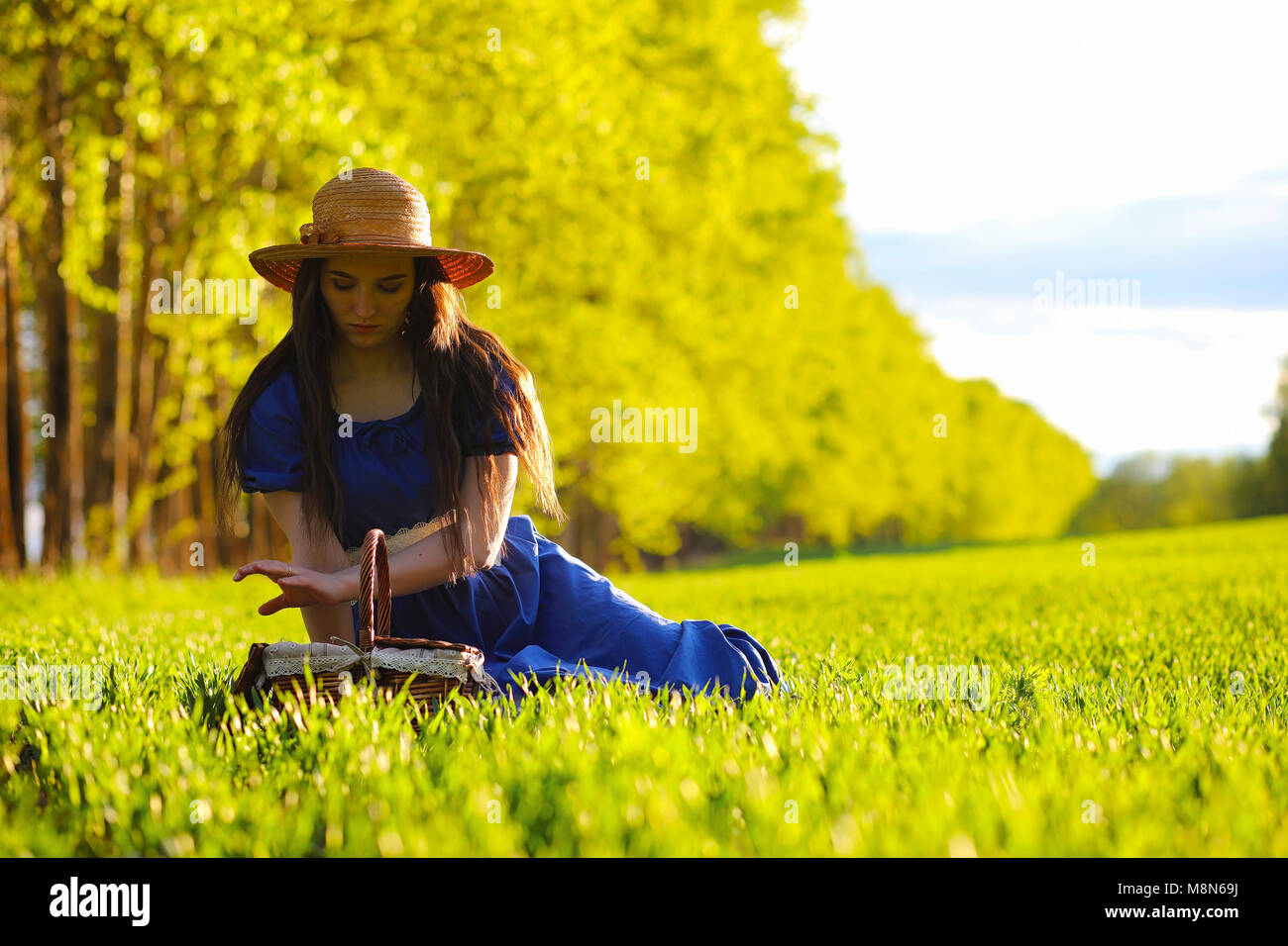 Girl in the countryside in the evening Stock Photo - Alamy
