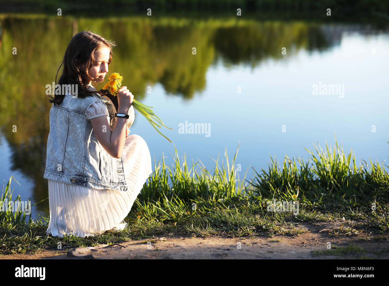 Girl in the park in the spring Stock Photo - Alamy