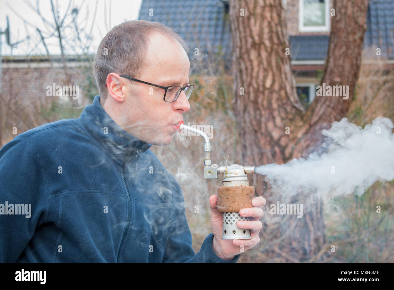 Smoker blowing smoke hi-res stock photography and images - Alamy