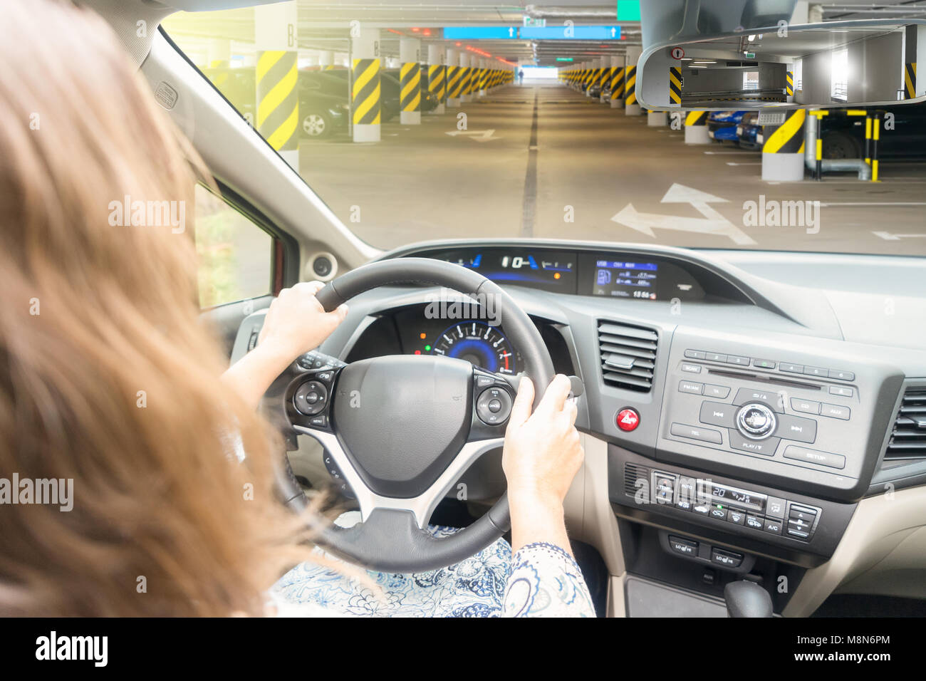 someone driving car at parking lot Stock Photo - Alamy