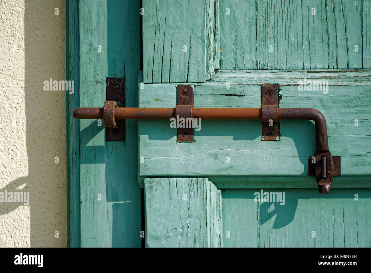 Rusty Ancient door latch, rough surface, sample for a postcard ...