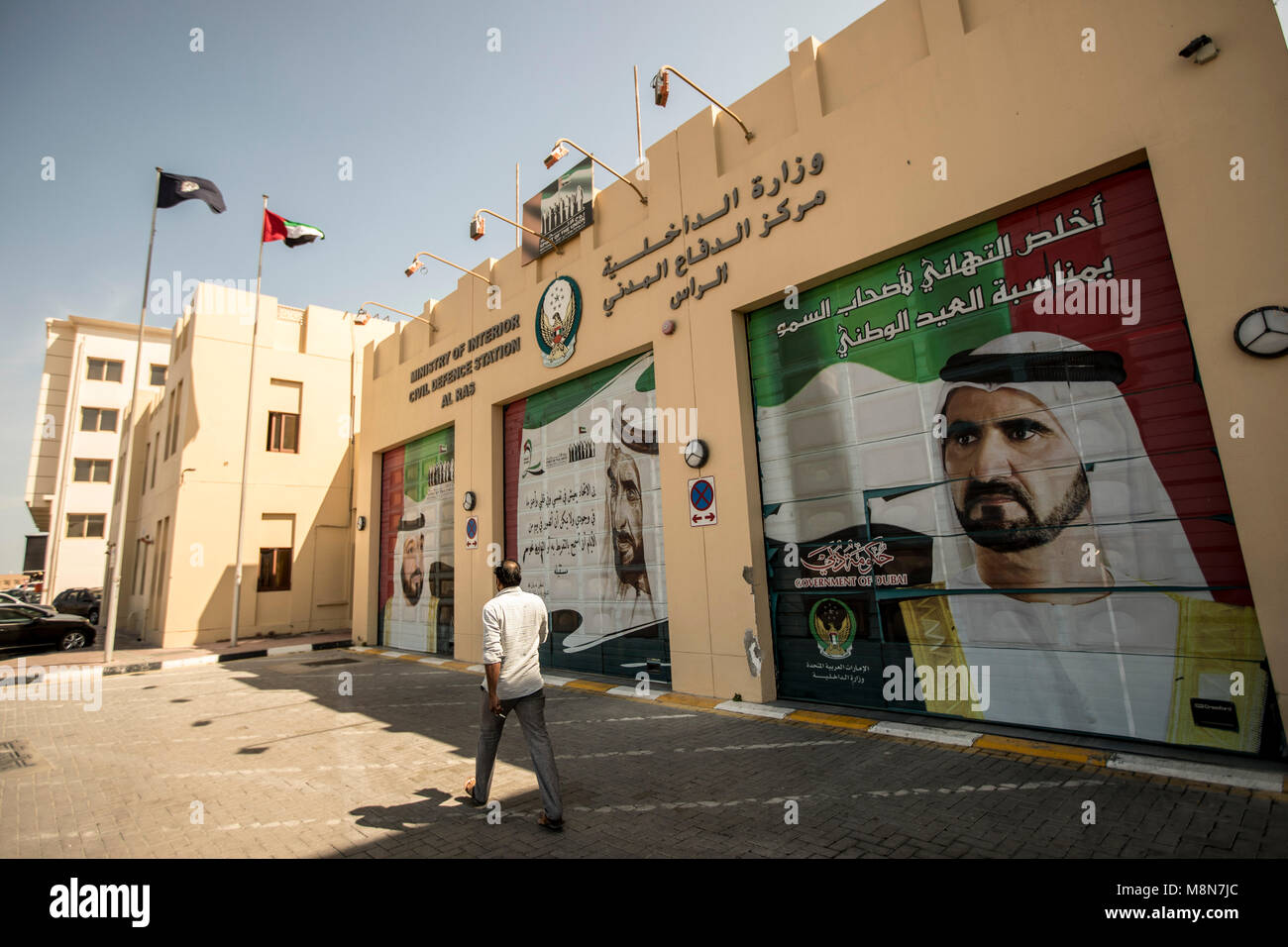 Man walking down the street in front of Ministry of Interior Civil ...