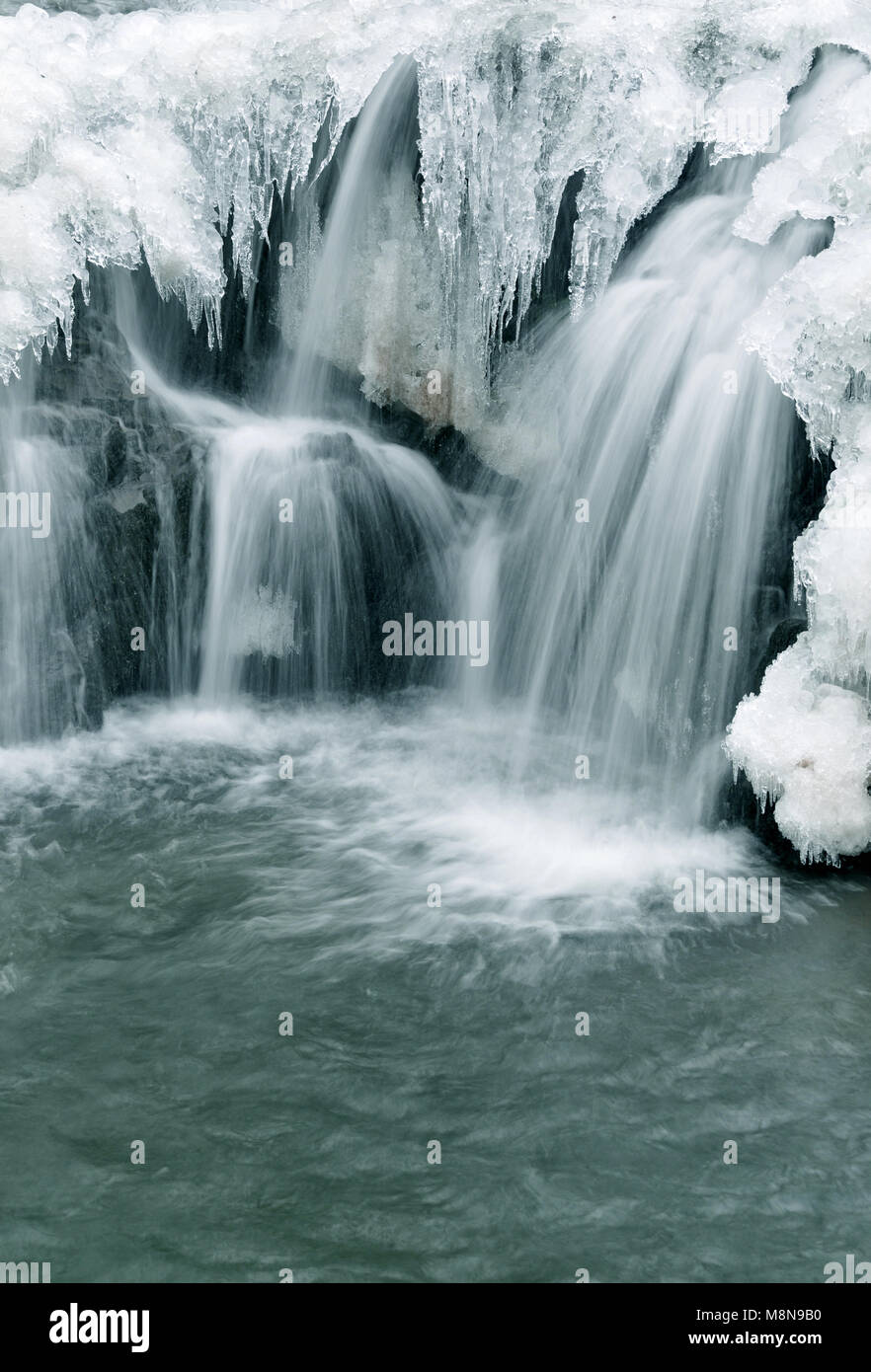 frozen river water beginning to melt Stock Photo - Alamy