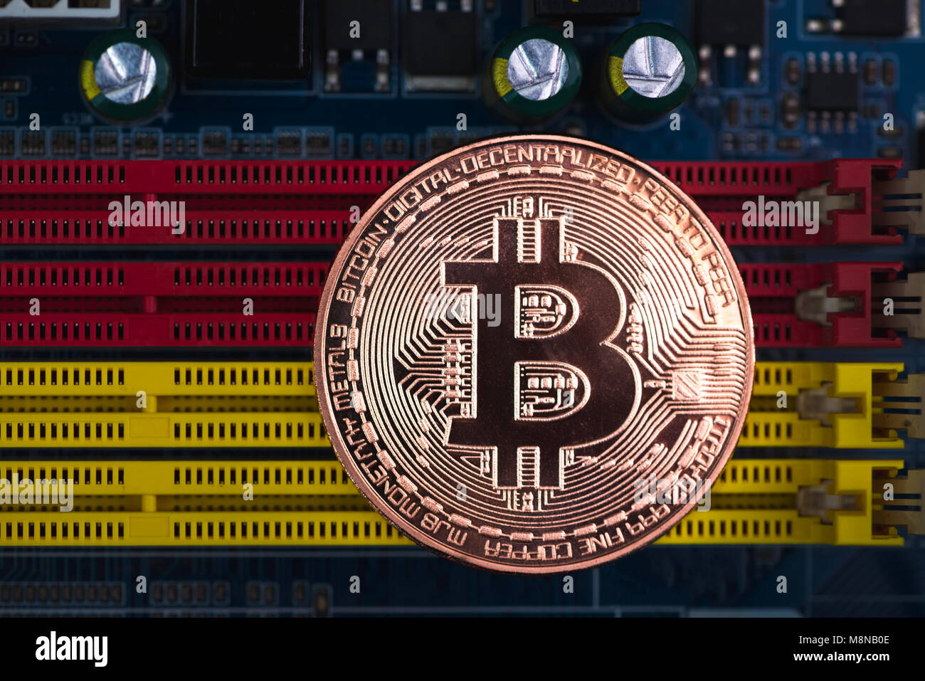 Bitcoin digital currency, bit-coin on motherboard or electronic board ...